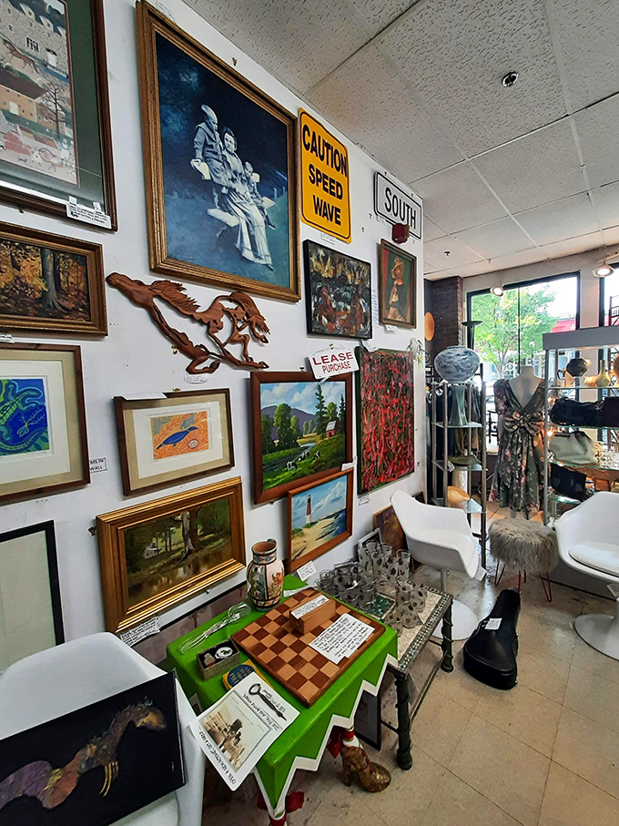 Wall-to-wall artwork creates a gallery where street signs and fine art coexist in democratic splendor. That chess set's calling your name!