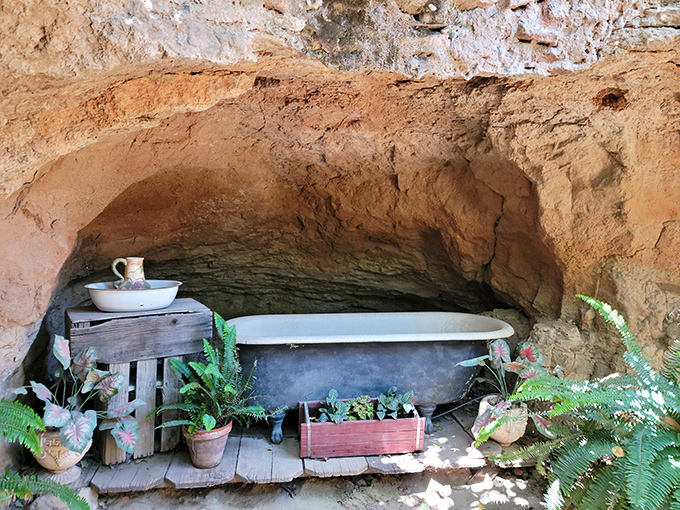 An underground bathtub carved from solid rock proves that even subterranean living requires proper hygiene and remarkable ambition.