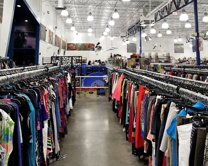 Clothing corridors stretch toward the horizon, each hanger potentially holding that perfect piece you never knew you needed until this moment.