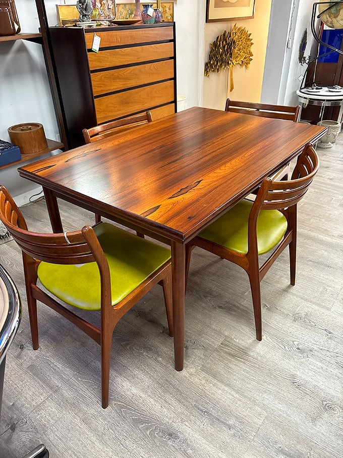 This rosewood dining set with lime green chairs isn't just furniture&mdash;it's a time capsule from when dinner parties were an art form.