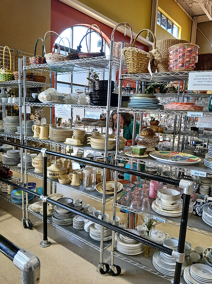 Dish heaven! Vintage patterns and everyday classics stack up on metal shelves, tempting collectors and practical shoppers alike.