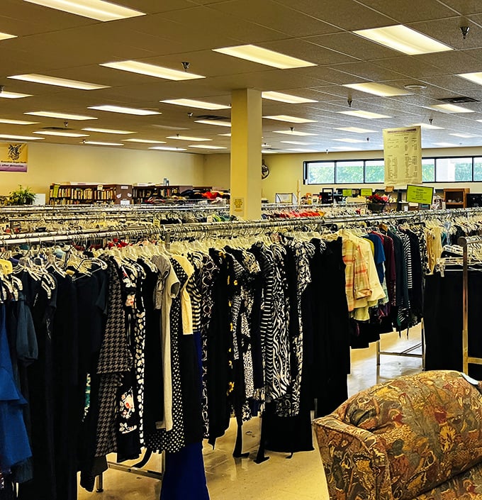Racks upon racks of carefully organized clothing create a textile library where fashion history lives on, waiting for its next chapter in someone's wardrobe.