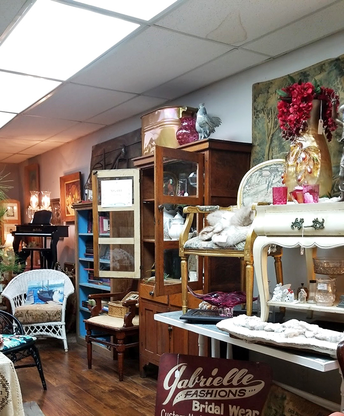 Every booth tells a story – this one featuring elegant furniture, vintage decor, and a sign for "Gabrielle Fashions" that hints at treasures from bygone eras.