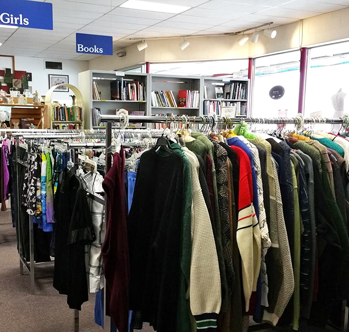 Where fashion meets literature—clothing racks stand at attention while bookshelves wait patiently in the background. The perfect marriage of style and substance.