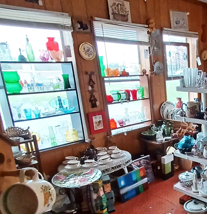 Sunlight streams through windows, illuminating colorful glassware displays that would make any collector's heart skip a beat. Depression glass heaven!