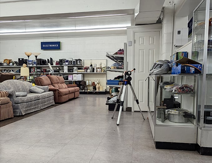 Electronics, furniture, and mysterious treasures all coexist peacefully in this well-lit corner where your next hobby might be waiting.
