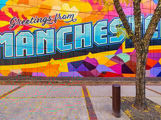 Street art that pops with more color than my Hawaiian shirt collection. This vibrant mural welcomes visitors with small-town charm and big-city creativity.