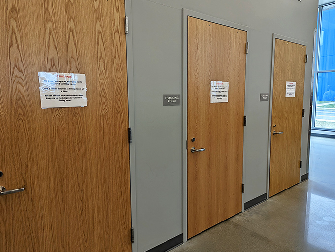 The fitting room corridor &ndash; where fashion dreams are confirmed or gently let down. The moment of truth awaits behind door number two!