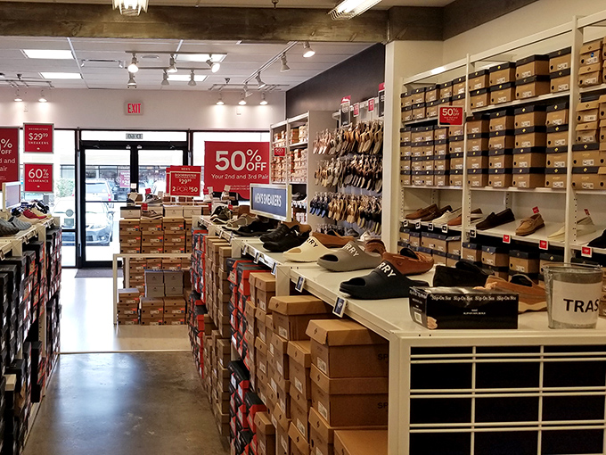 Shoe heaven exists, and it's organized by size. Those red 50% off signs are the retail equivalent of a double rainbow.