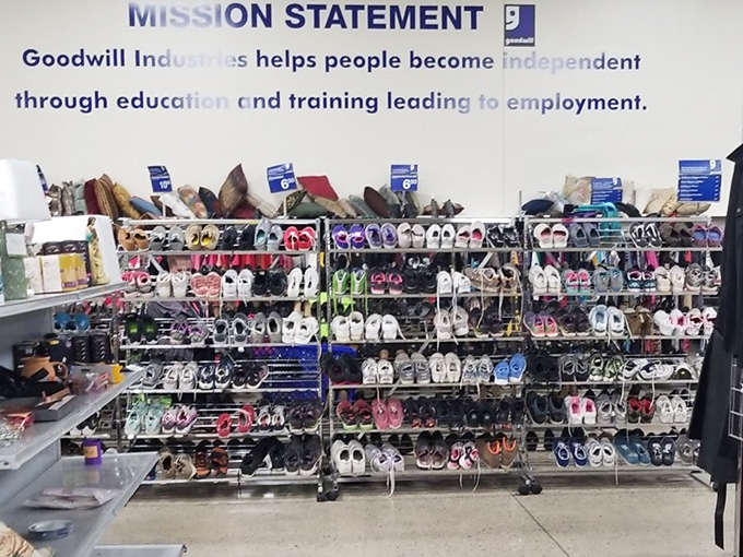 Rows of shoes organized like a footwear library, where every pair has a story and none of them involve buyer's remorse.