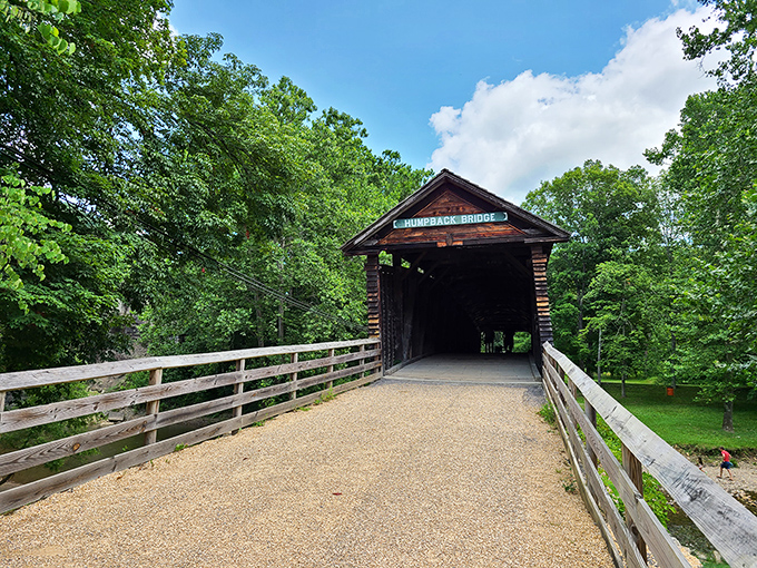 The entrance beckons like a time portal. That "Humpback Bridge" sign might as well read "Abandon all hurry, ye who enter here."