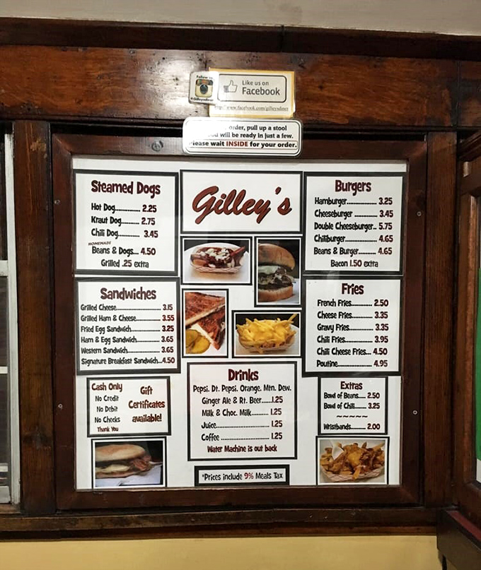 The menu board at Gilley's tells you everything you need to know about life's simple pleasures—steamed dogs, burgers, and that glorious poutine.