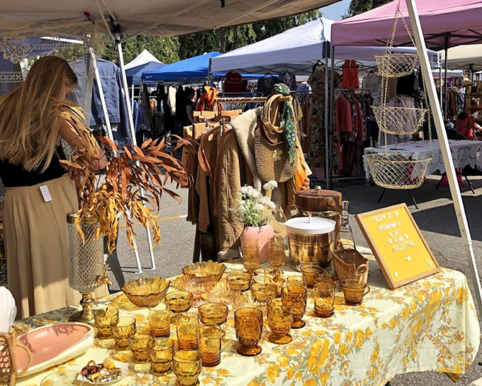 Amber glassware catches the sunlight like liquid gold, while neutral-toned clothing waits patiently for its second act.