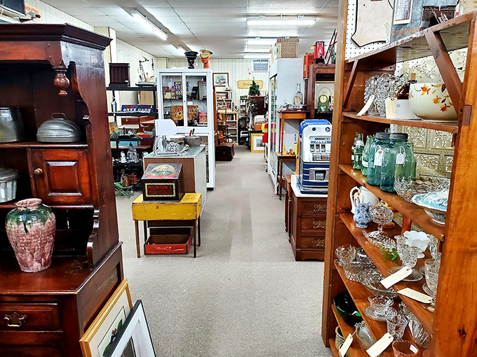 Wide aisles showcase an eclectic mix of furniture and glassware, each piece waiting for rediscovery.