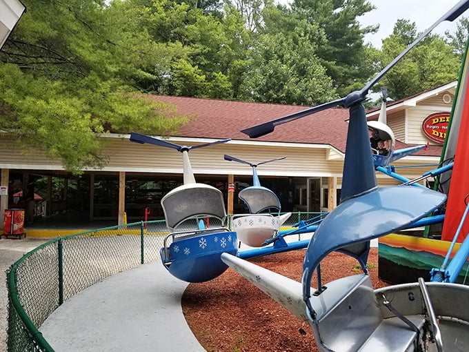 Snowflake-decorated ride buckets spinning in summer sunshine&mdash;because physics can't stop holiday spirit from taking flight.