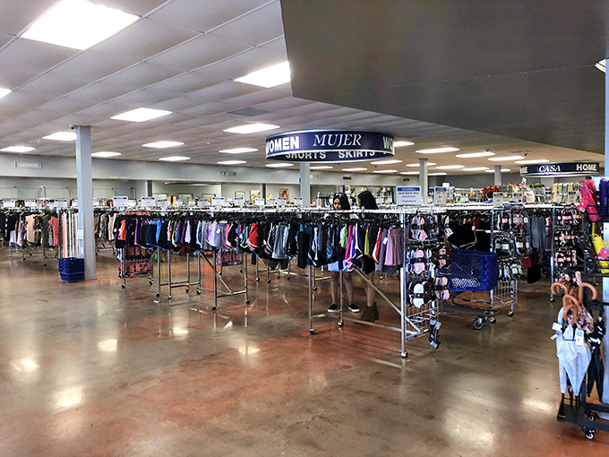 A shopper's paradise unfolds with neatly organized racks creating colorful corridors of fashion possibilities waiting to be discovered.