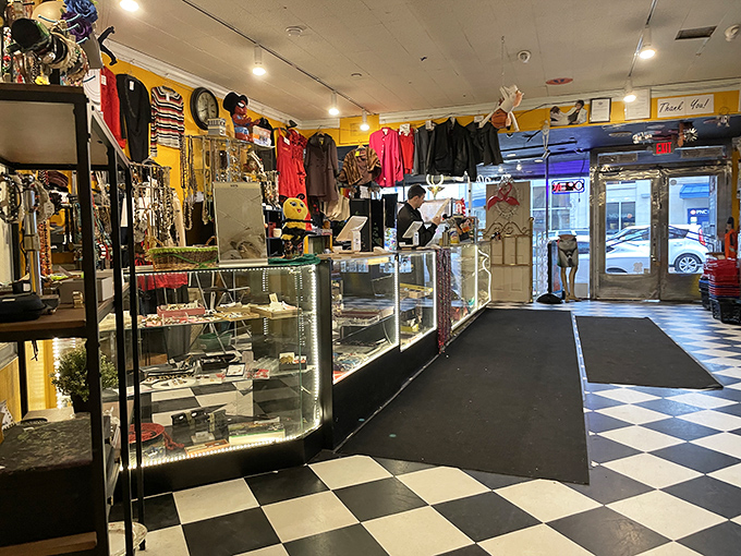 The classic checkerboard floor leads you into a wonderland of vintage finds, where glass display cases guard the most precious treasures.