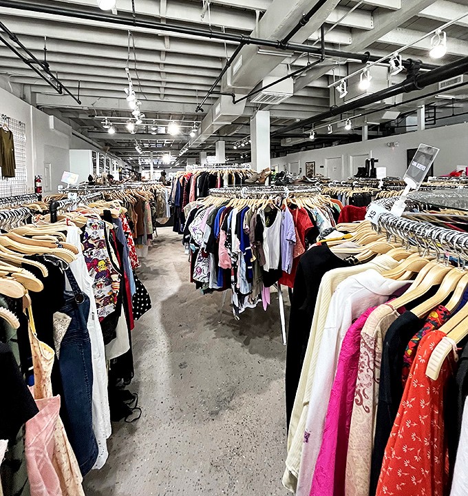 Inside Avalon Exchange, racks stretch toward infinity like a fashion library where every hanger holds a story waiting to be continued.