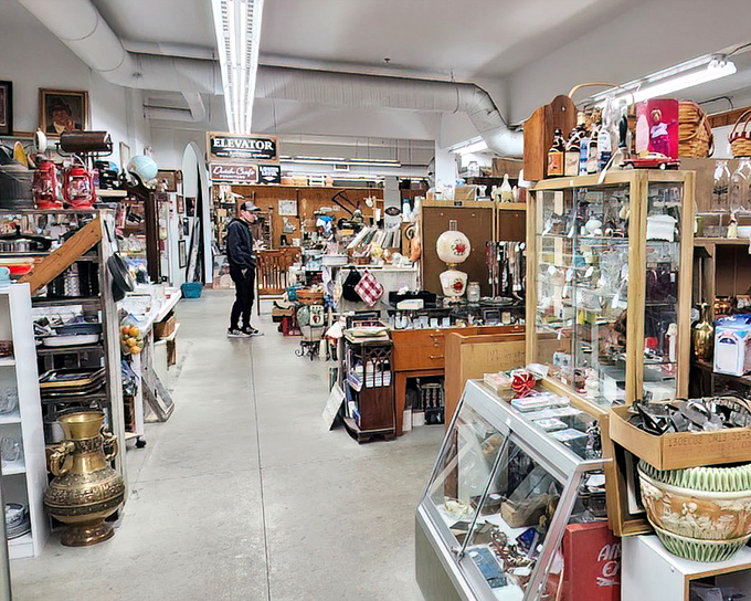Treasure hunters navigate aisles of history, where every turn reveals another vendor's carefully curated collection of yesteryear's finest.