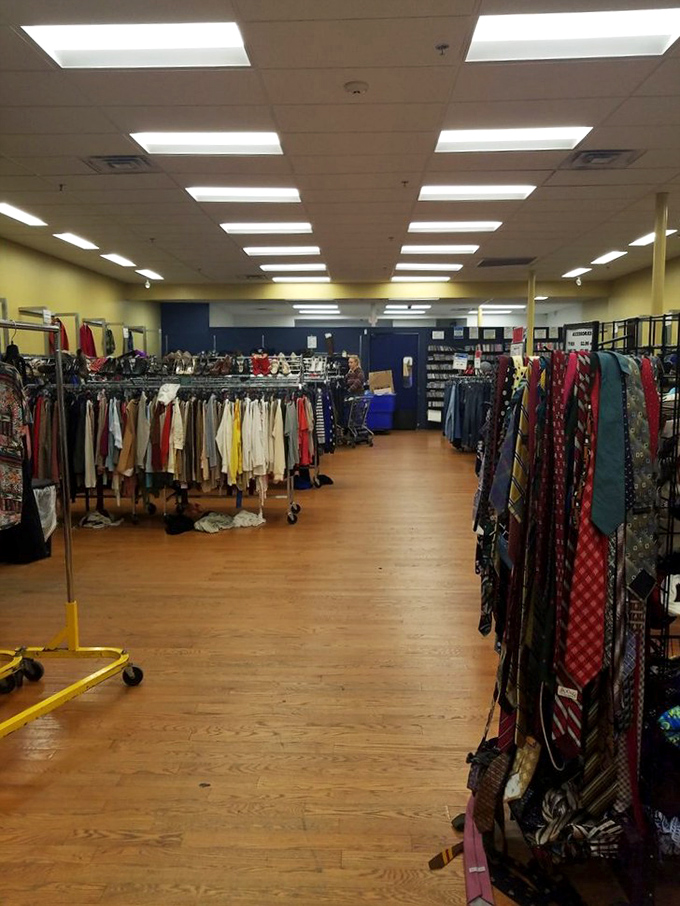 Racks upon racks of clothing create a textile landscape where patient shoppers can mine for designer gems hiding among everyday garments.