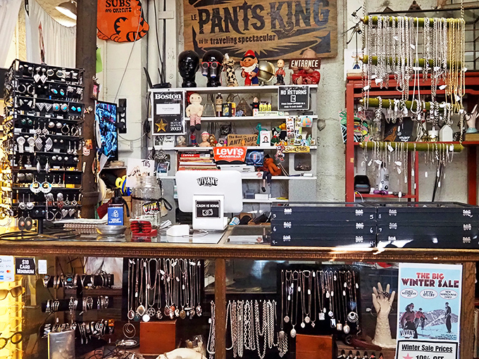 The jewelry counter gleams with decades of adornment history. Each necklace hanging here once completed someone's perfect night out.