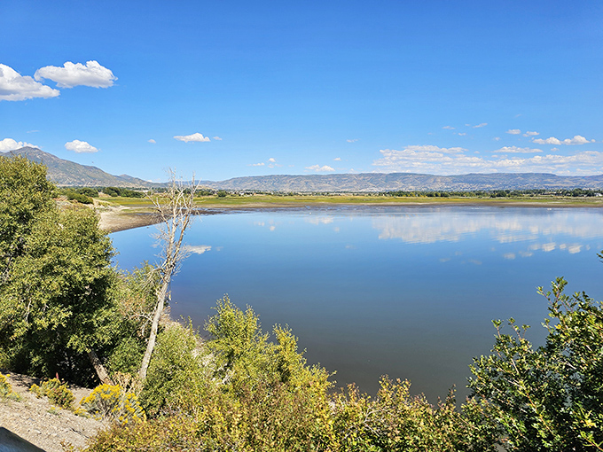 Where mountains meet water in a landscape so perfect, you'll wonder if you've accidentally wandered into a desktop wallpaper.