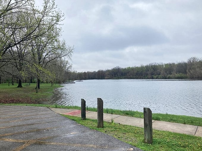 The lake's serene surface mirrors the sky, creating that rare moment when you can't tell where water ends and heaven begins.