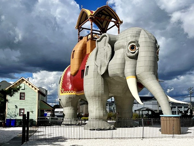 Storm clouds gather dramatically behind Lucy, as if Mother Nature herself is providing the perfect backdrop for this Victorian pachyderm palace.