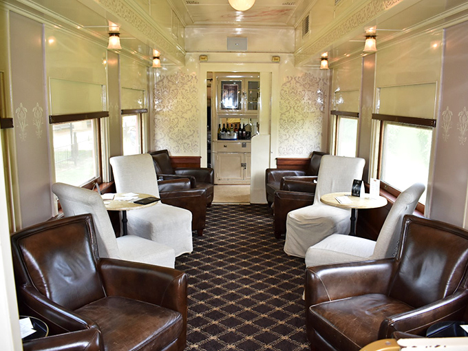 Step into this elegant parlor car and you're instantly transported to an era when travel was an occasion worthy of leather chairs and polished wood.