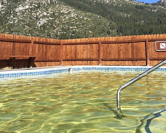 The pools sit nestled against the mountains, proving nature occasionally gets the spa concept absolutely right.