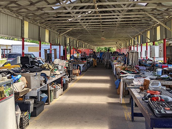 Treasure-lined corridors stretch into the distance, where one person's castoffs become another's prized possessions under the shelter of metal roofs.