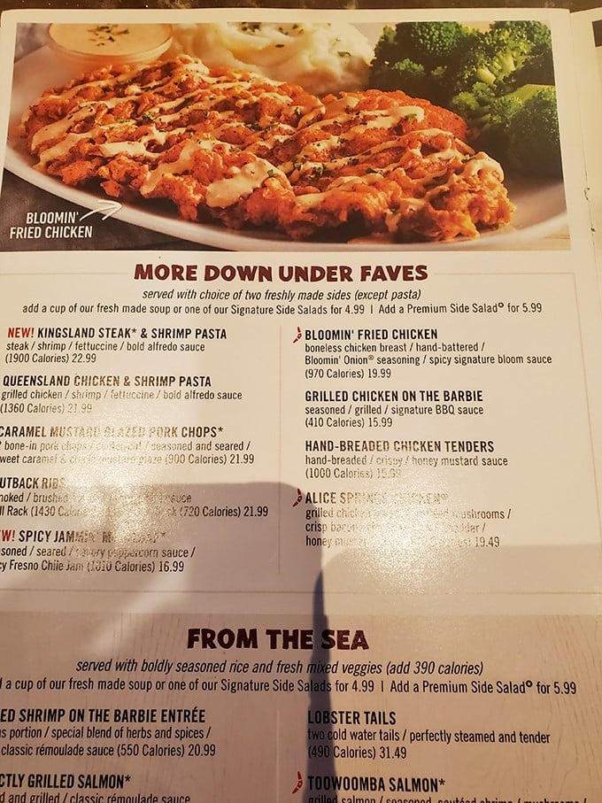 The menu reads like a passport to flavor country&mdash;Bloomin' Fried Chicken and Lobster Tails beckon from their glossy pages.