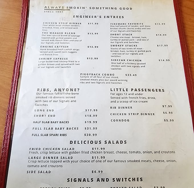 The menu reads like a love letter to smoked meat enthusiasts&mdash;"Engineer's Entrees" and "Little Passengers" continuing the charming railroad theme.