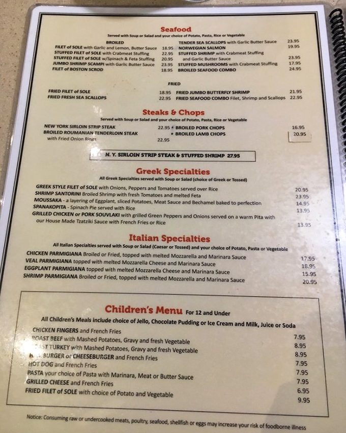 A menu that reads like a United Nations of comfort food. Greek moussaka, Italian classics, and American standards peacefully coexisting on one delicious page.