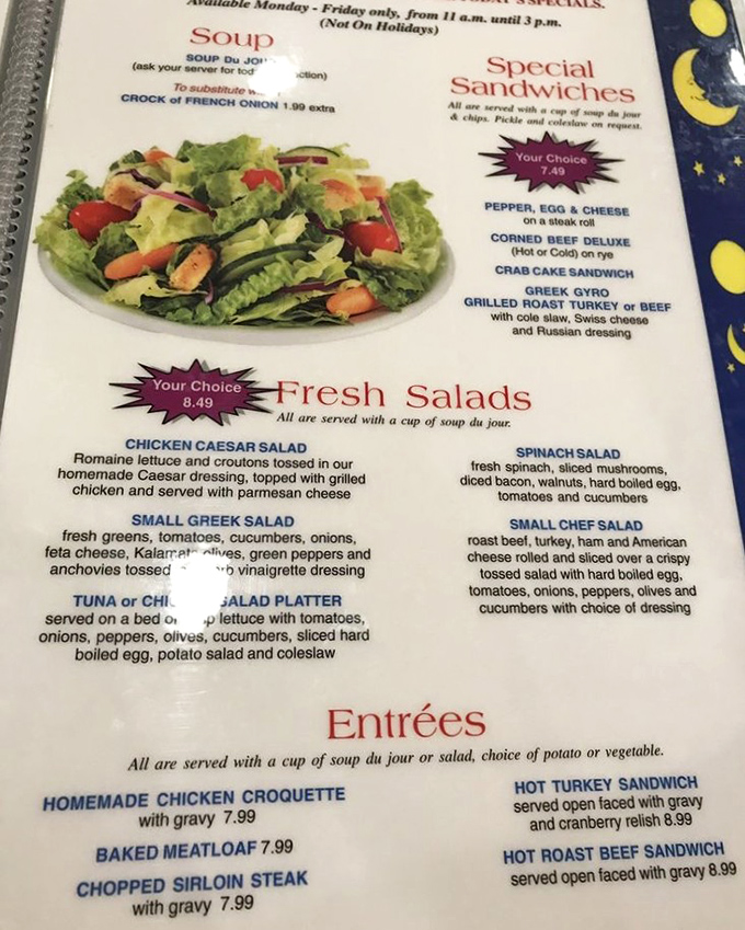 The menu tells the whole story: homemade comfort classics without pretension. That meatloaf listing is the star of this paper show.