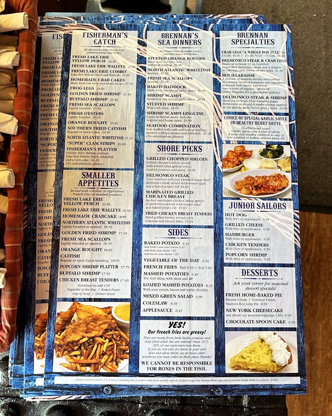 The legendary menu at Brennan's&mdash;a blue-bordered roadmap to seafood nirvana. Notice they proudly declare "Our French fries are greasy!" That's confidence you can taste.
