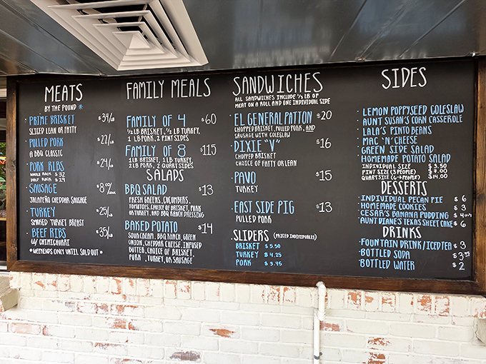 The chalkboard menu reads like barbecue poetry – no fancy fonts needed when the food speaks this eloquently.