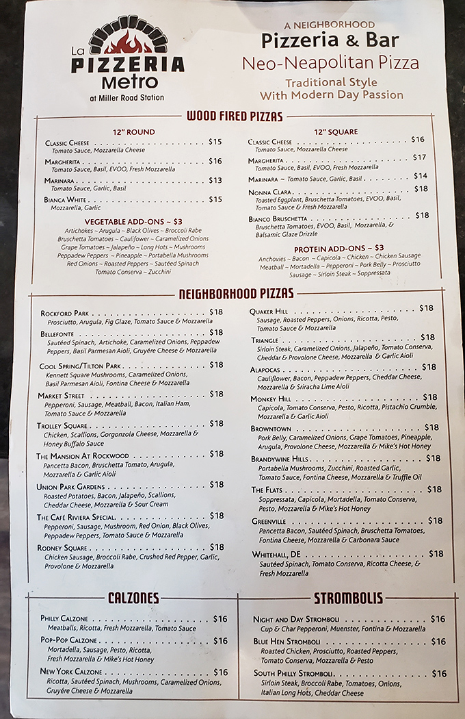 A menu that reads like a love letter to Delaware neighborhoods, each pizza telling its own delicious story.