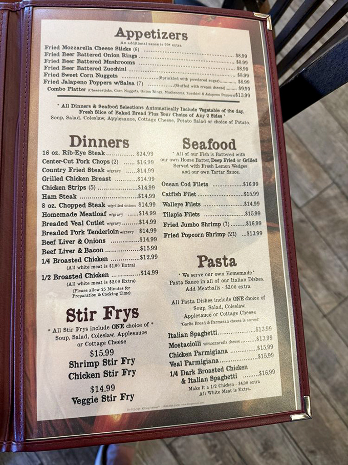 A menu that reads like a love letter to American comfort food. Each laminated page promises satisfaction that chain restaurants can only dream of replicating.