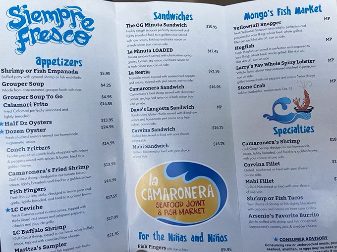 The menu showcases La Camaronera's seafood treasures, from the legendary Pan con Minuta to fresh ceviches and perfectly fried shrimp specialties.