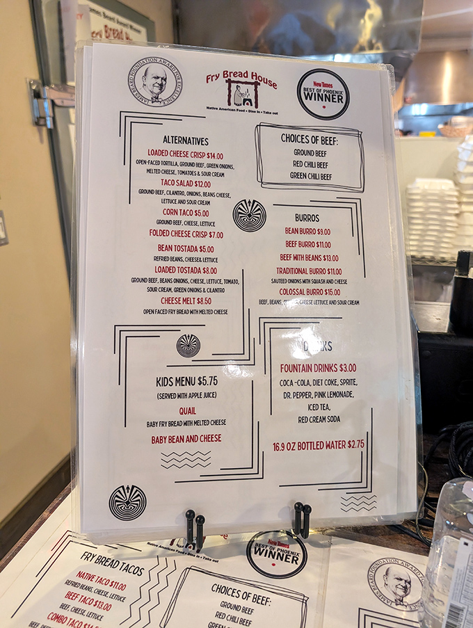 The menu tells a story of cultural preservation through food&mdash;notice the traditional symbols and the James Beard Award winner seal.