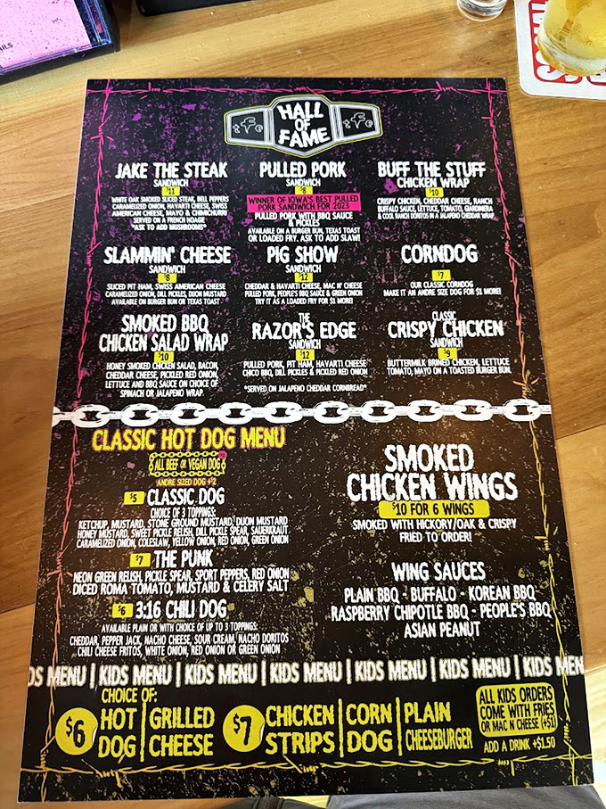 The menu reads like a wrestling card from the golden era—each sandwich a contender for your affection, each description a promise of flavor glory.