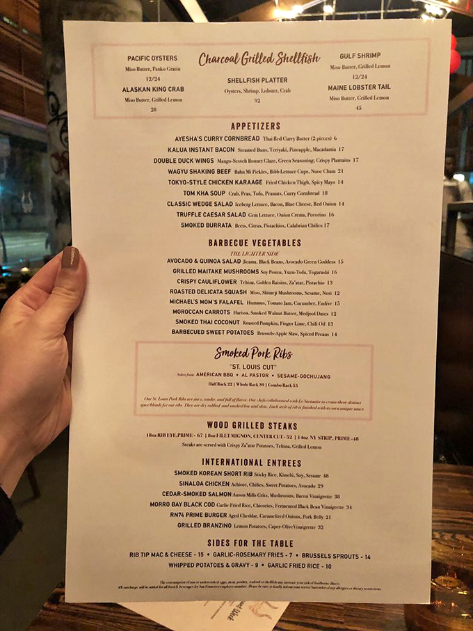 The menu reads like a passport to flavor country, with each dish telling its own story of smoke, spice, and everything nice.