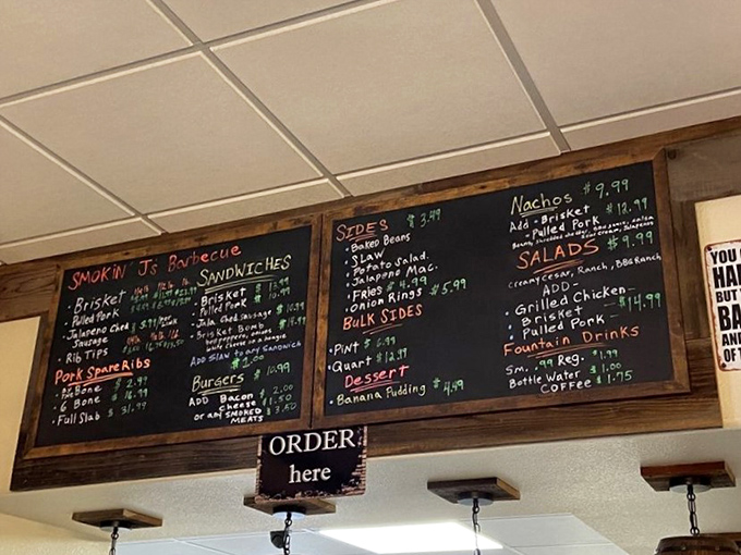 A chalkboard menu that cuts right to the chase: meat, sides, and the promise of satisfaction. No fancy fonts needed when the food speaks this loudly.
