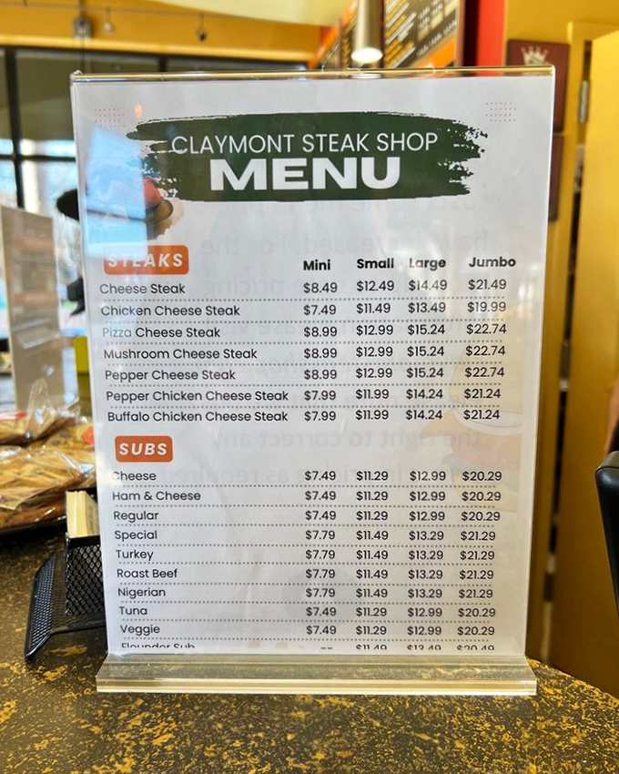 The menu board tells a simple truth: in the hierarchy of sandwich needs, cheesesteaks deserve their own special category above all others.