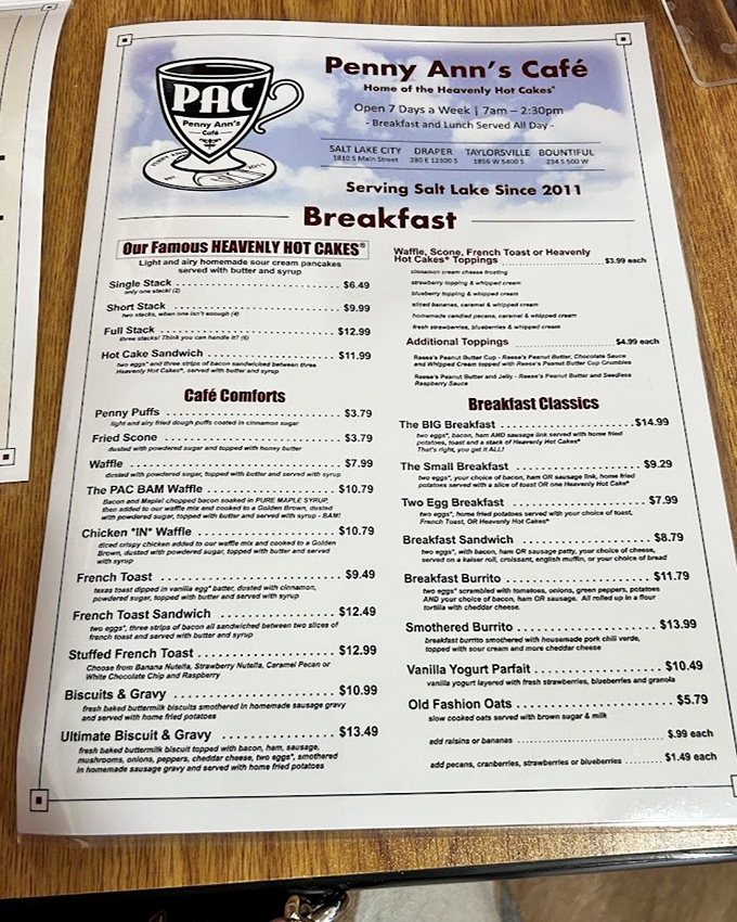 A menu that reads like breakfast poetry. The "Heavenly Hot Cakes" aren't just cleverly named—they're a religious experience for your taste buds.