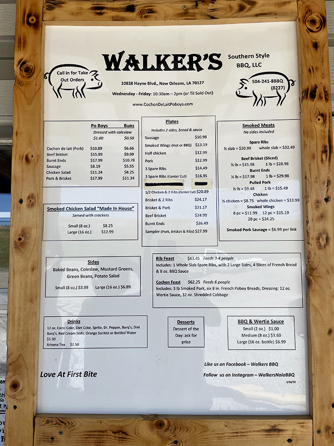 A menu framed in rustic wood that reads like a love letter to smoked meat enthusiasts. Decision paralysis has never been so delicious.