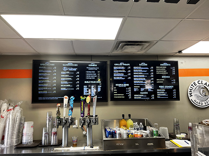 The menu board tells stories of sandwiches past, present, and future—a delicious timeline of Auburn's culinary history hanging above eager customers.