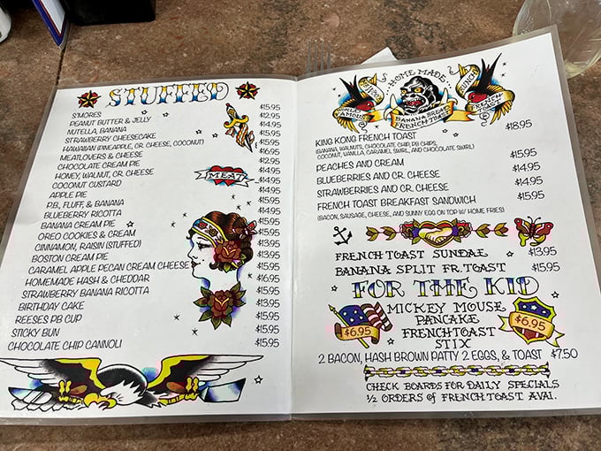 The hand-drawn menu reads like a love letter to indulgence, with "Stuffed" French toast options that would make even your cardiologist secretly jealous.