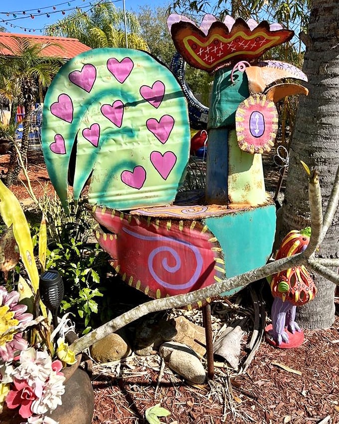 This heart-covered bird sculpture looks ready to deliver Valentine's cards year-round. Cupid must have taken a pottery class.